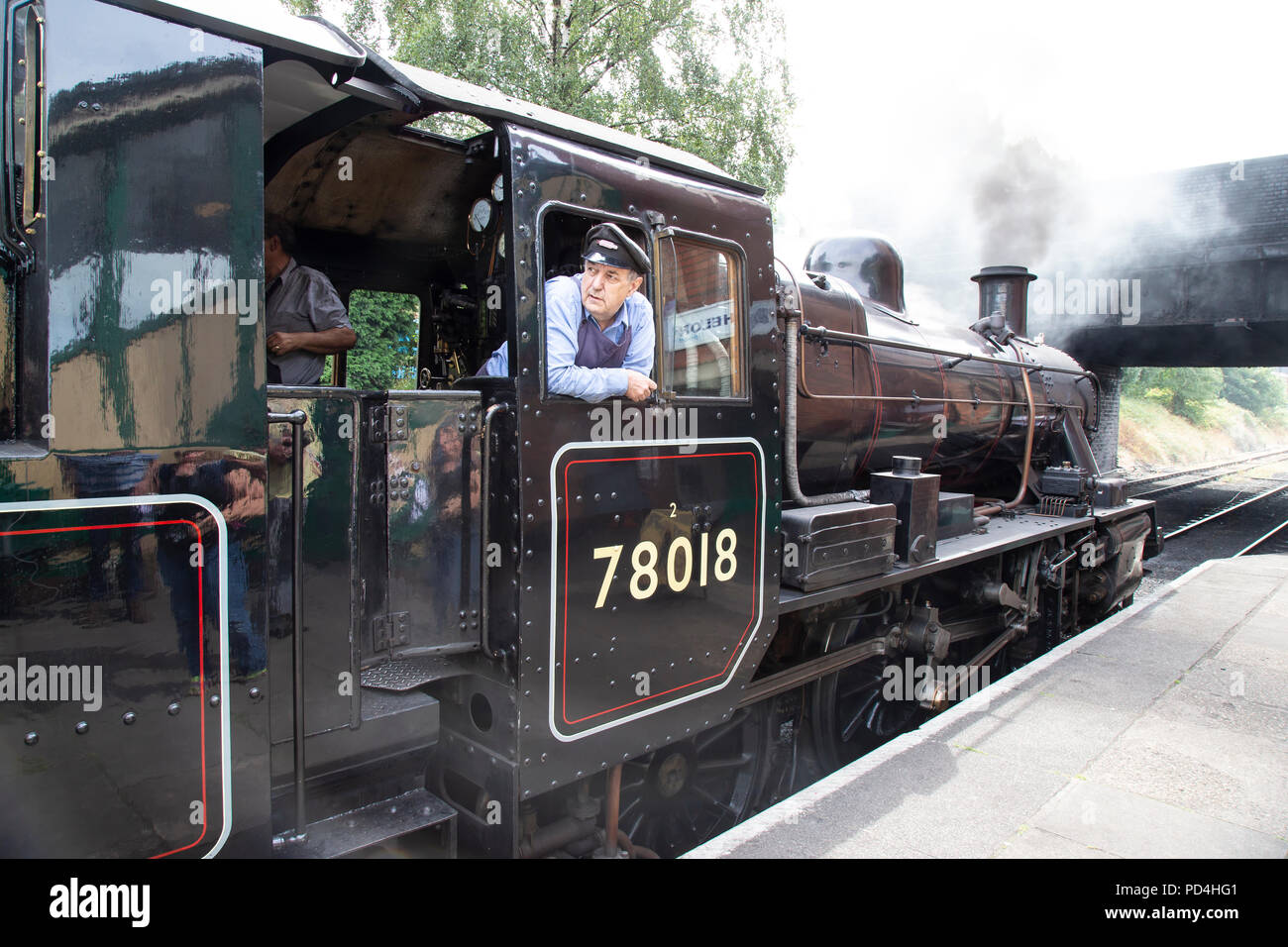 Engine driver on the footplate of No.78018 British Railways Standard ...