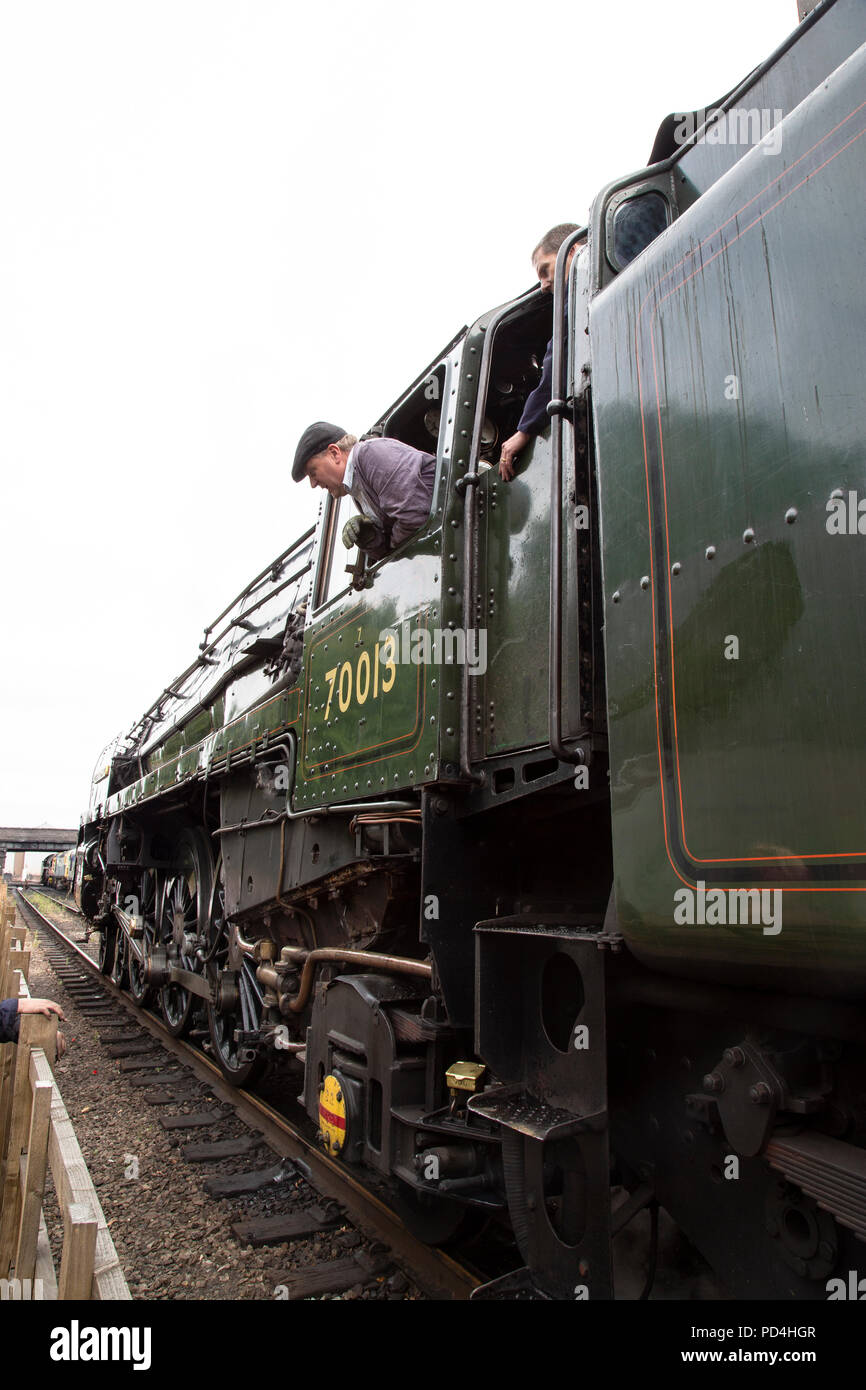 Engine driver and fireman looking out of the cab on B.R. Steam ...