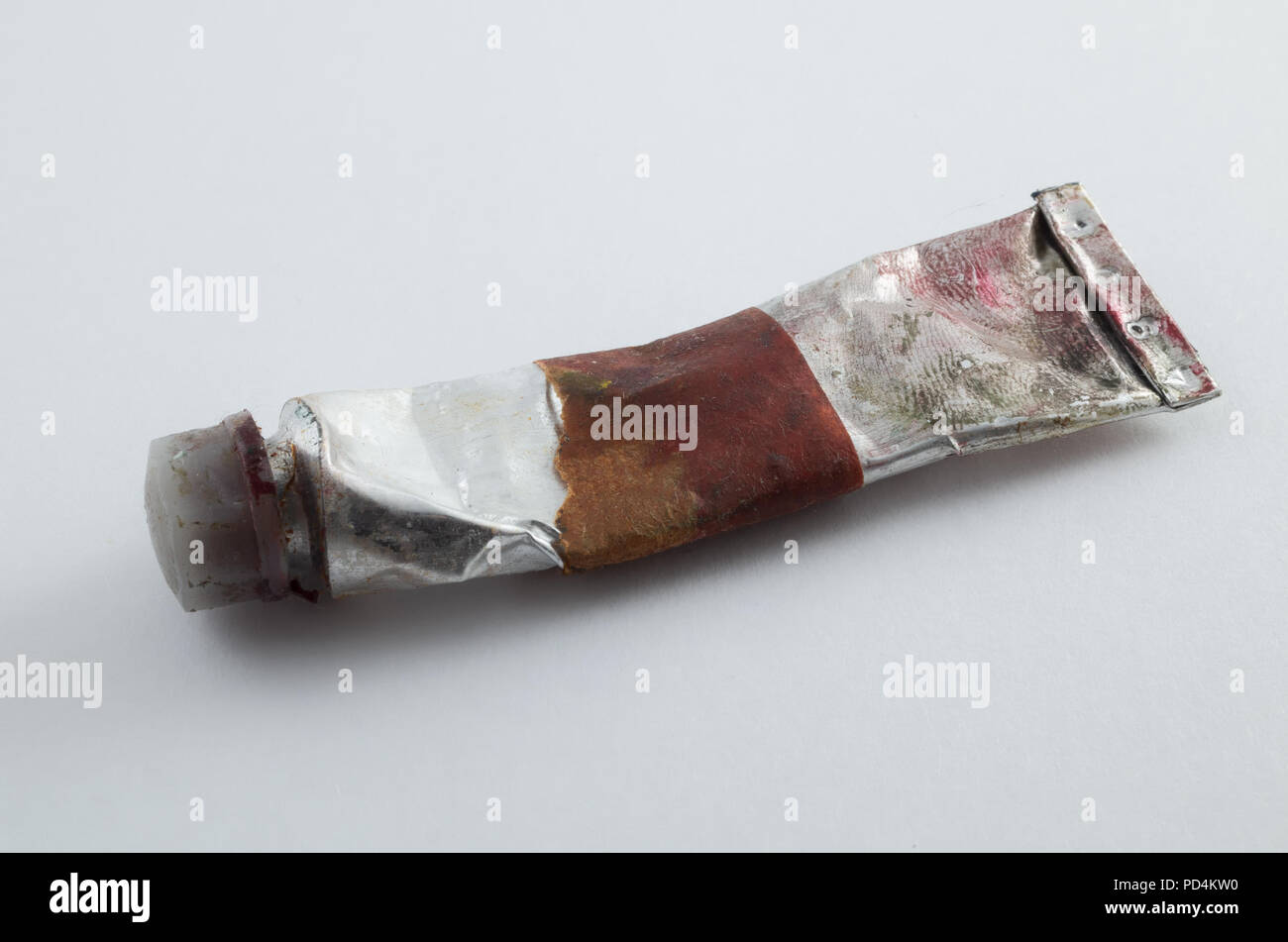old tube of oil paint, isolated on white background Stock Photo - Alamy