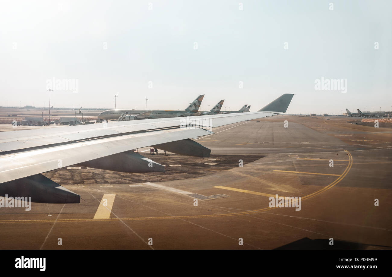 Aerial view out of airplane window while taking off from the runway of ...