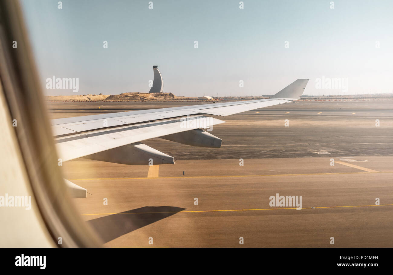 Aerial view out of airplane window while taking off from the runway of ...