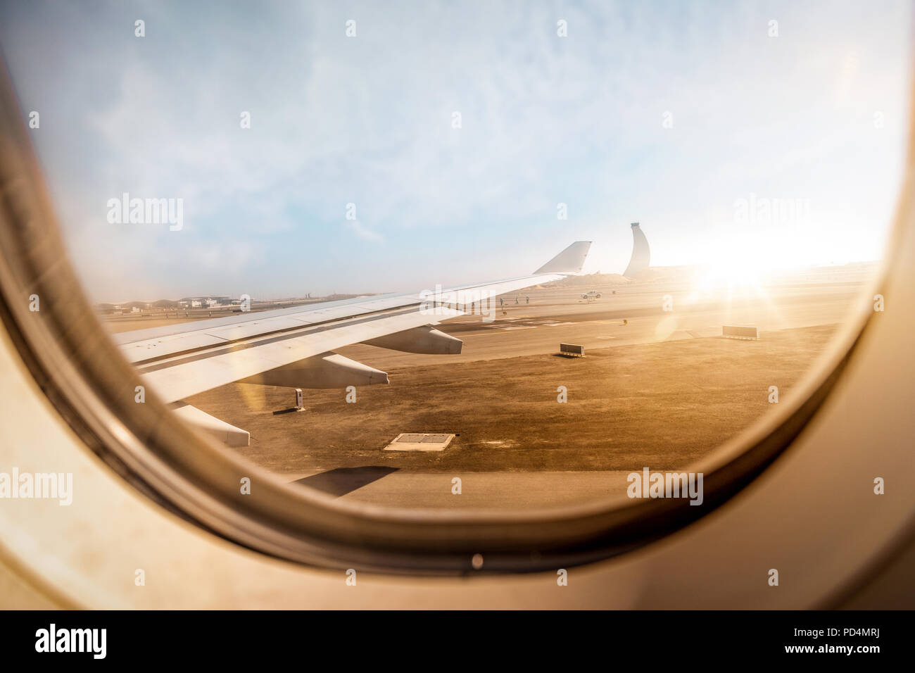 Aerial view out of airplane window while taking off from the runway of ...