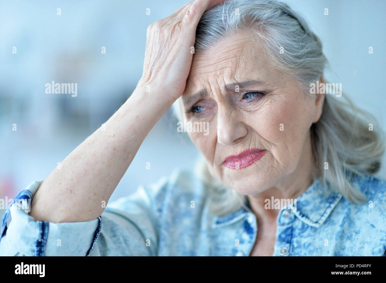 portrait of senior woman with headache Stock Photo - Alamy