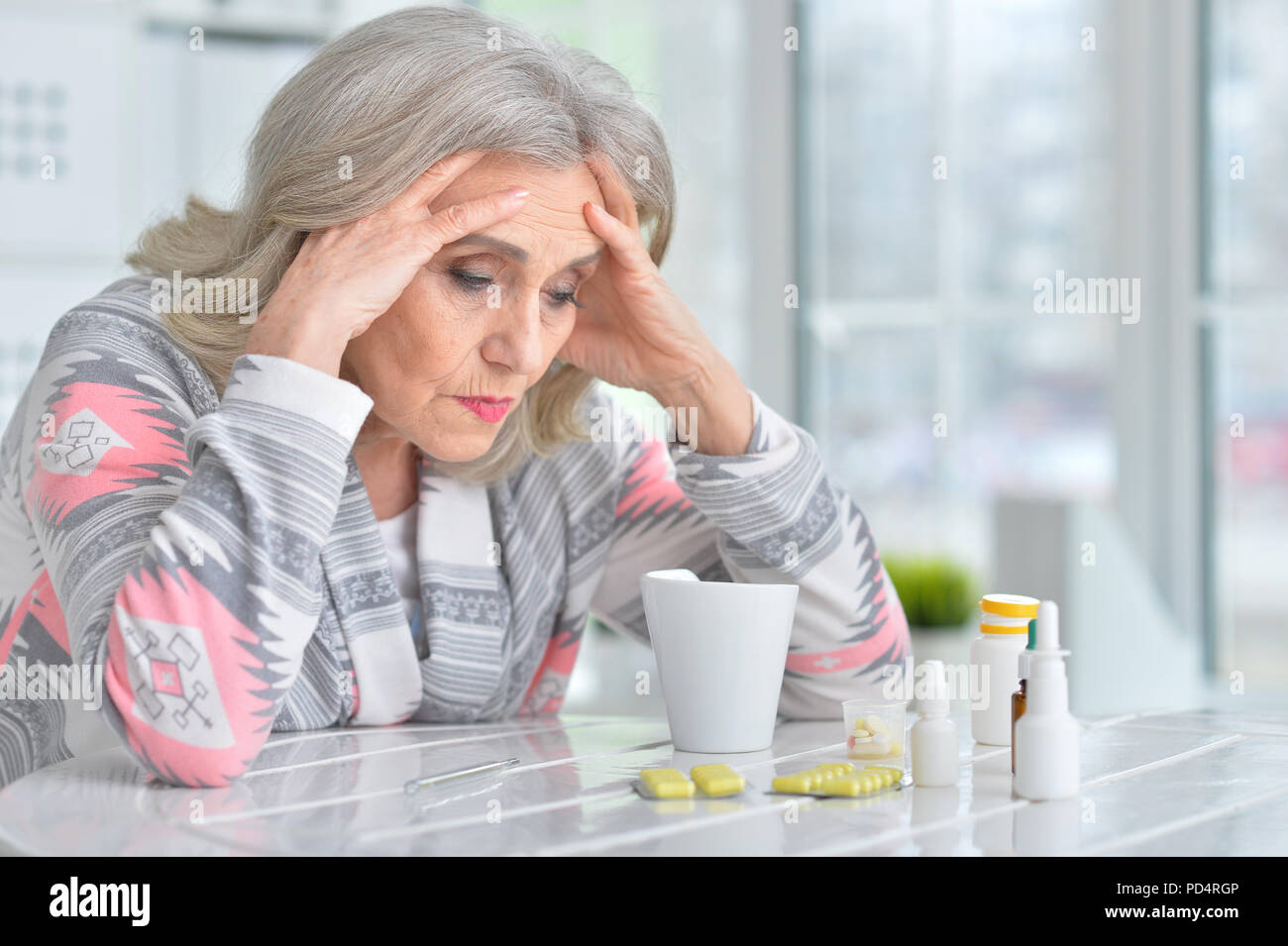 senior woman with headache Stock Photo - Alamy