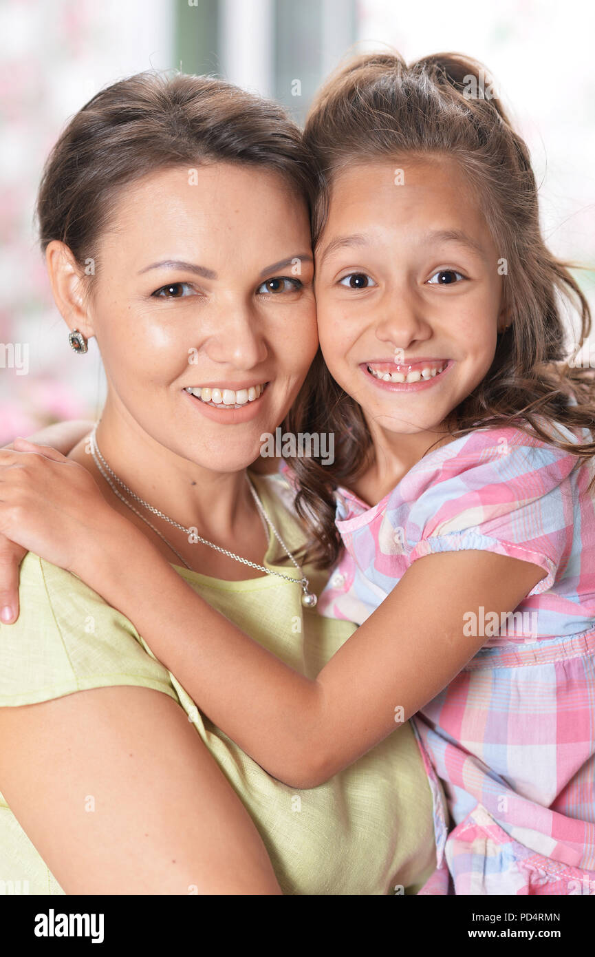 beautiful woman and girl hugging Stock Photo - Alamy