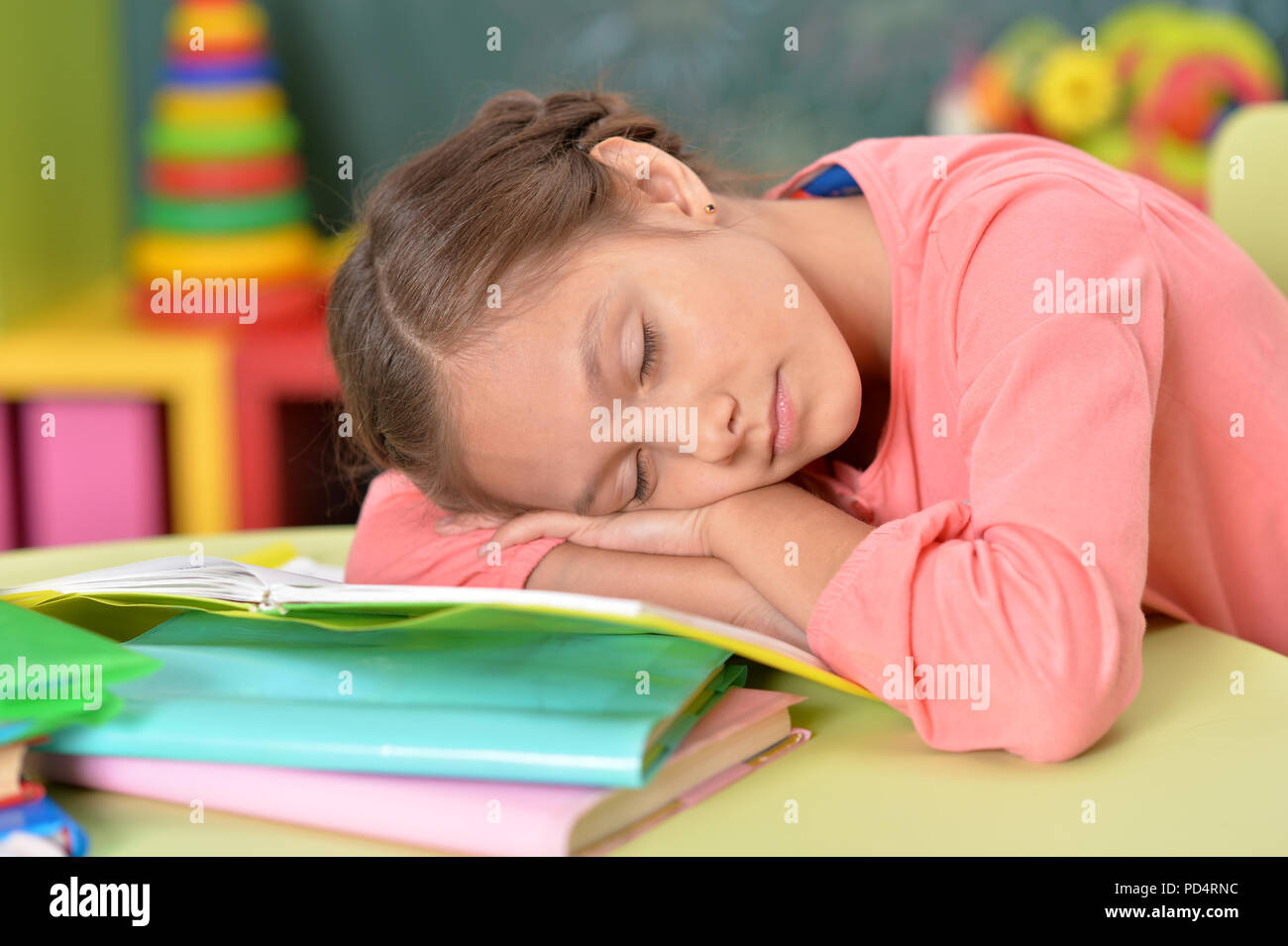 Schoolgirl tired doing homework hi-res stock photography and images - Alamy