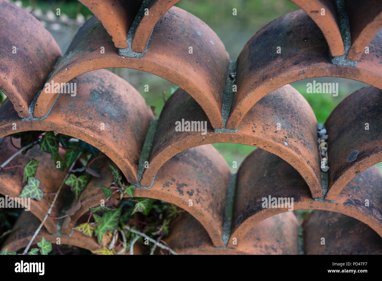 old terracotta wall installation in garden artistic design Stock Photo ...
