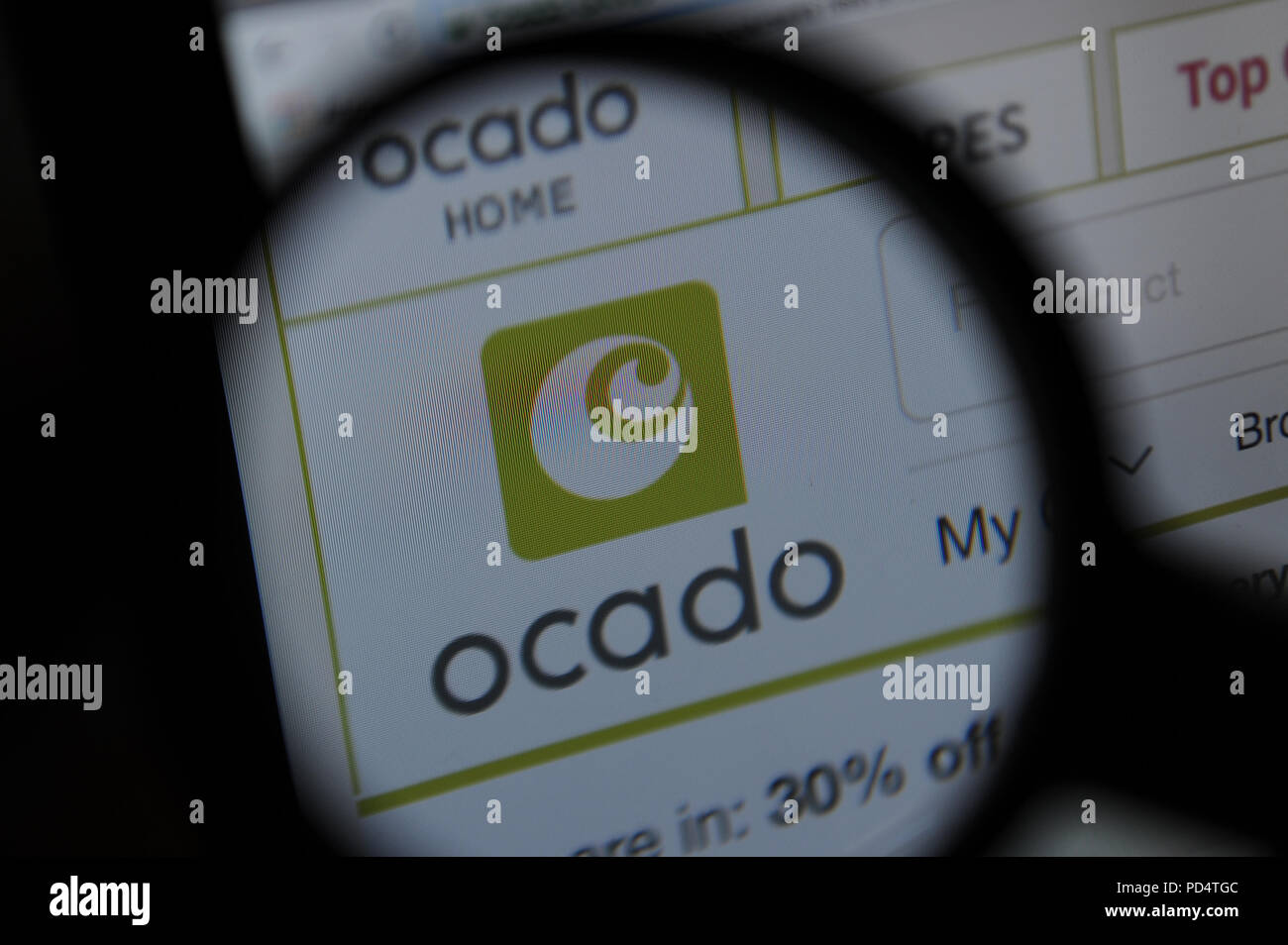 The ocado website seen through a magnifying glass Stock Photo - Alamy