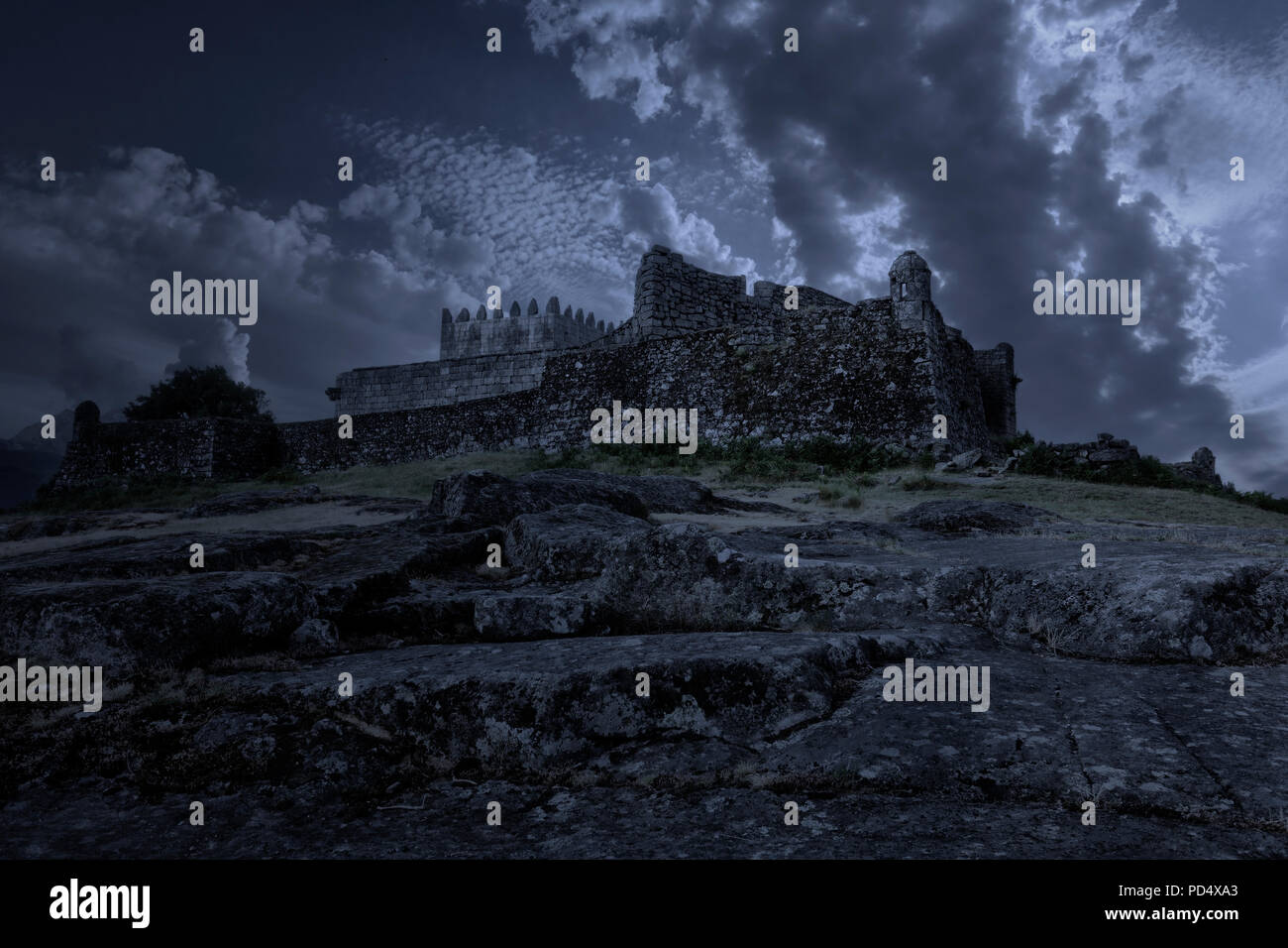 Remote european medieval castle at night Stock Photo - Alamy