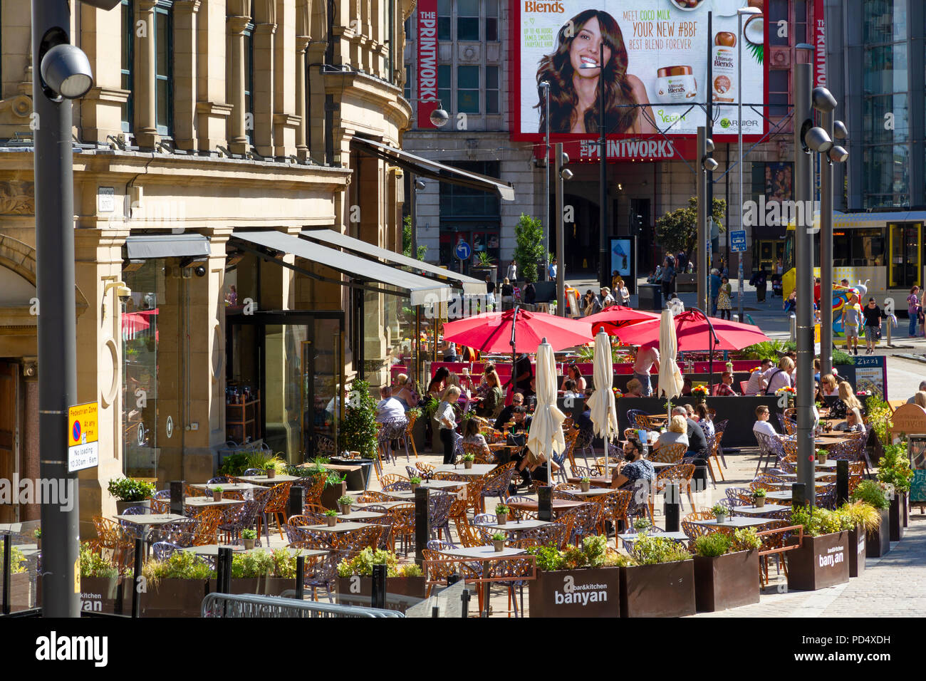 People dining outside the Corn Exchange, in Exchange Square Manchester ...