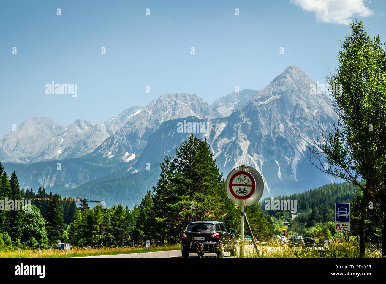 View of the Zugspitze mountains in Austrian alps in summer with holiday ...
