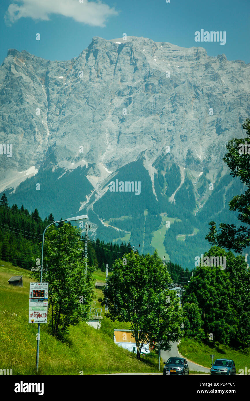 View of the Zugspitze mountains in Austrian alps in summer with holiday ...