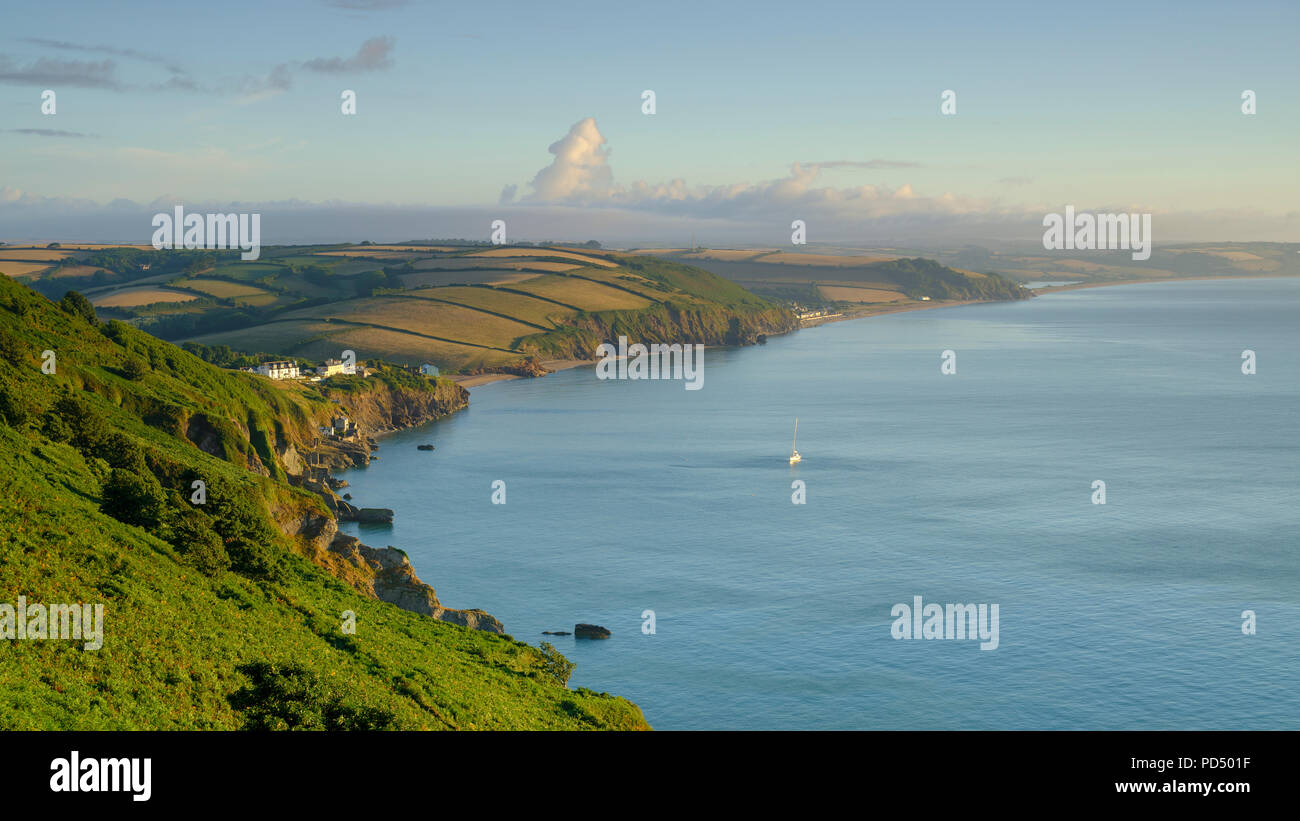 Sunrise over Start Bay from near the light house looking along the ...