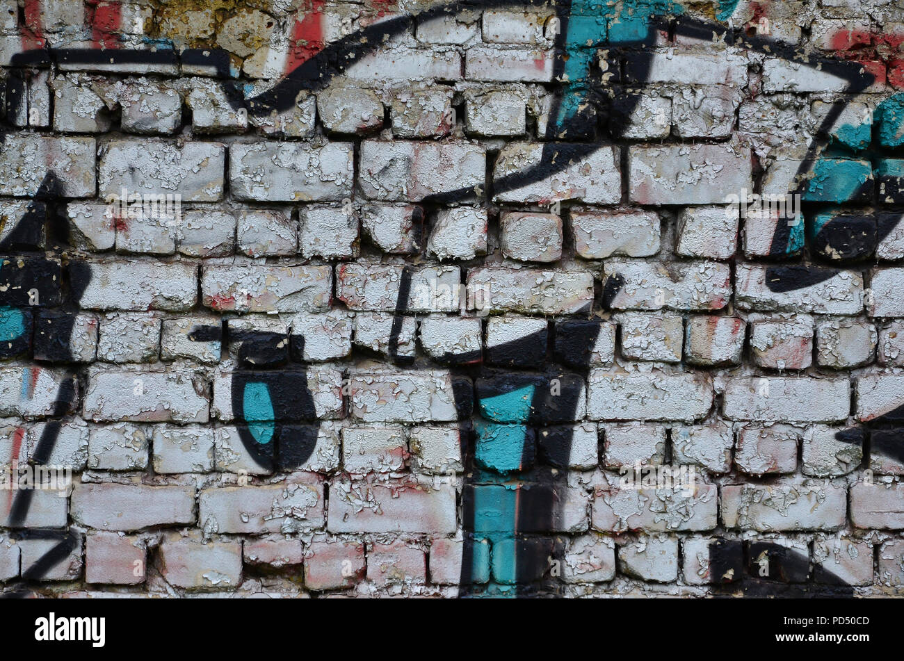 Detailed image of very old and aged color graffiti drawing on the wall ...