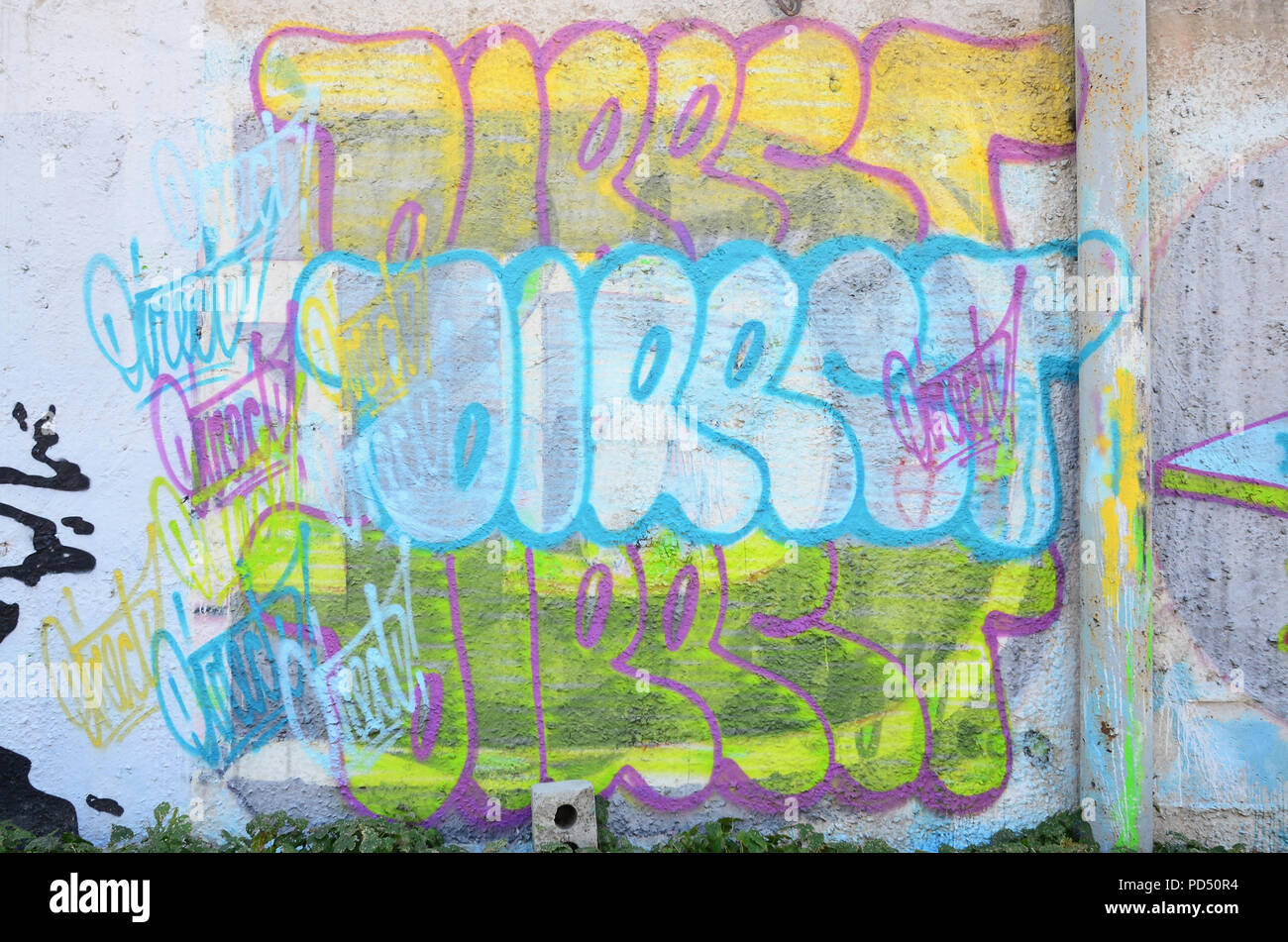 The texture of the wall with graffiti, which is depicted on it. The ...