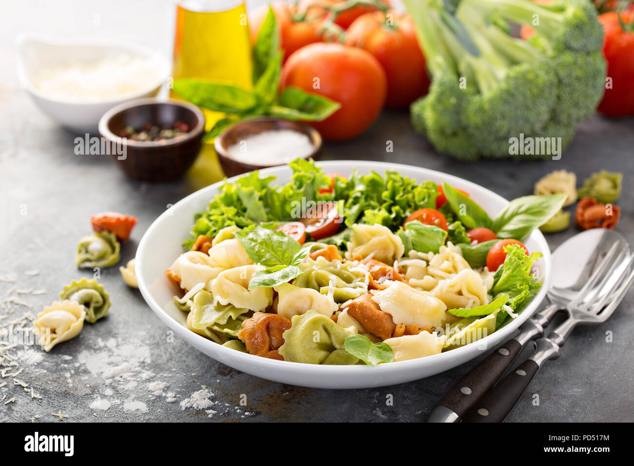 Rainbow cheese tortellini with fresh vegetables and salad Stock Photo ...