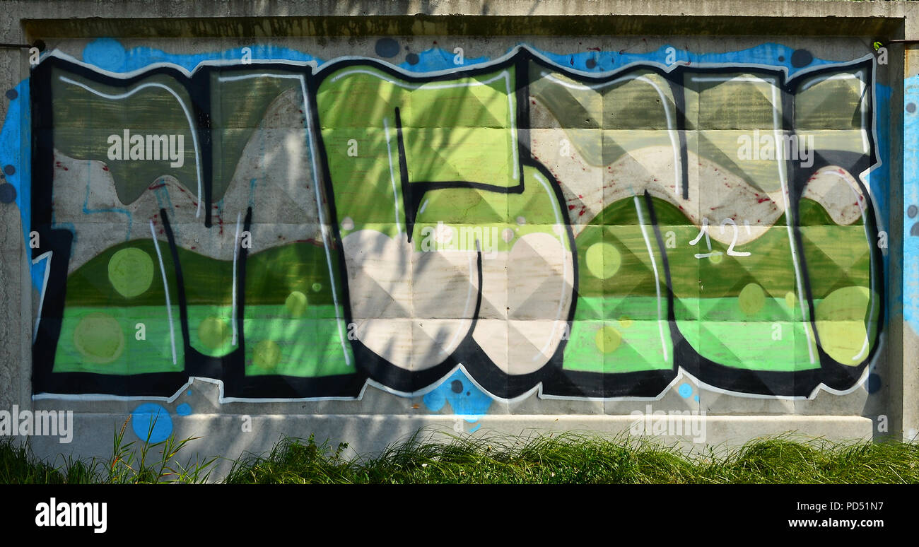 The texture of the wall with graffiti, which is depicted on it. The ...