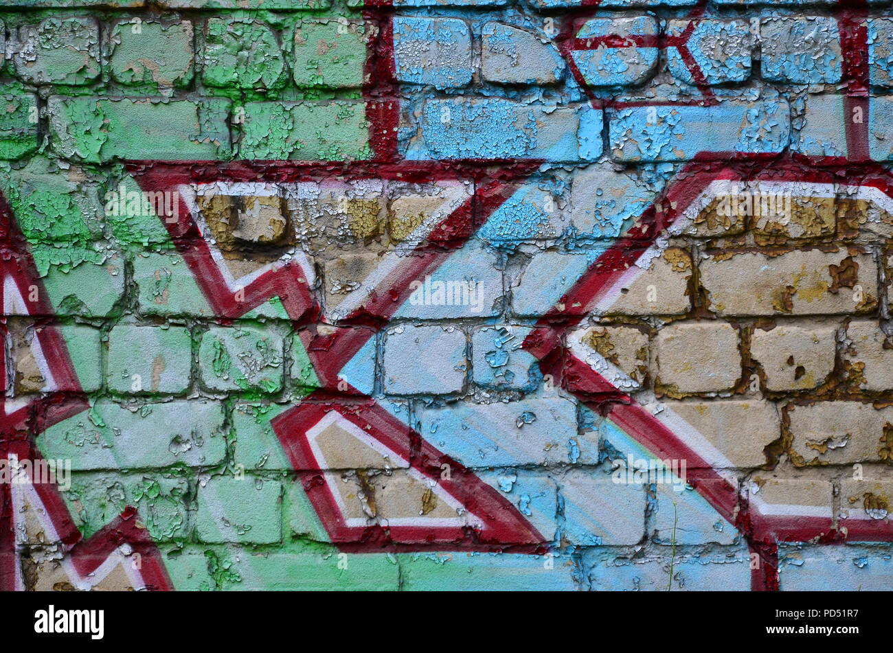 Detailed image of very old and aged color graffiti drawing on the wall ...