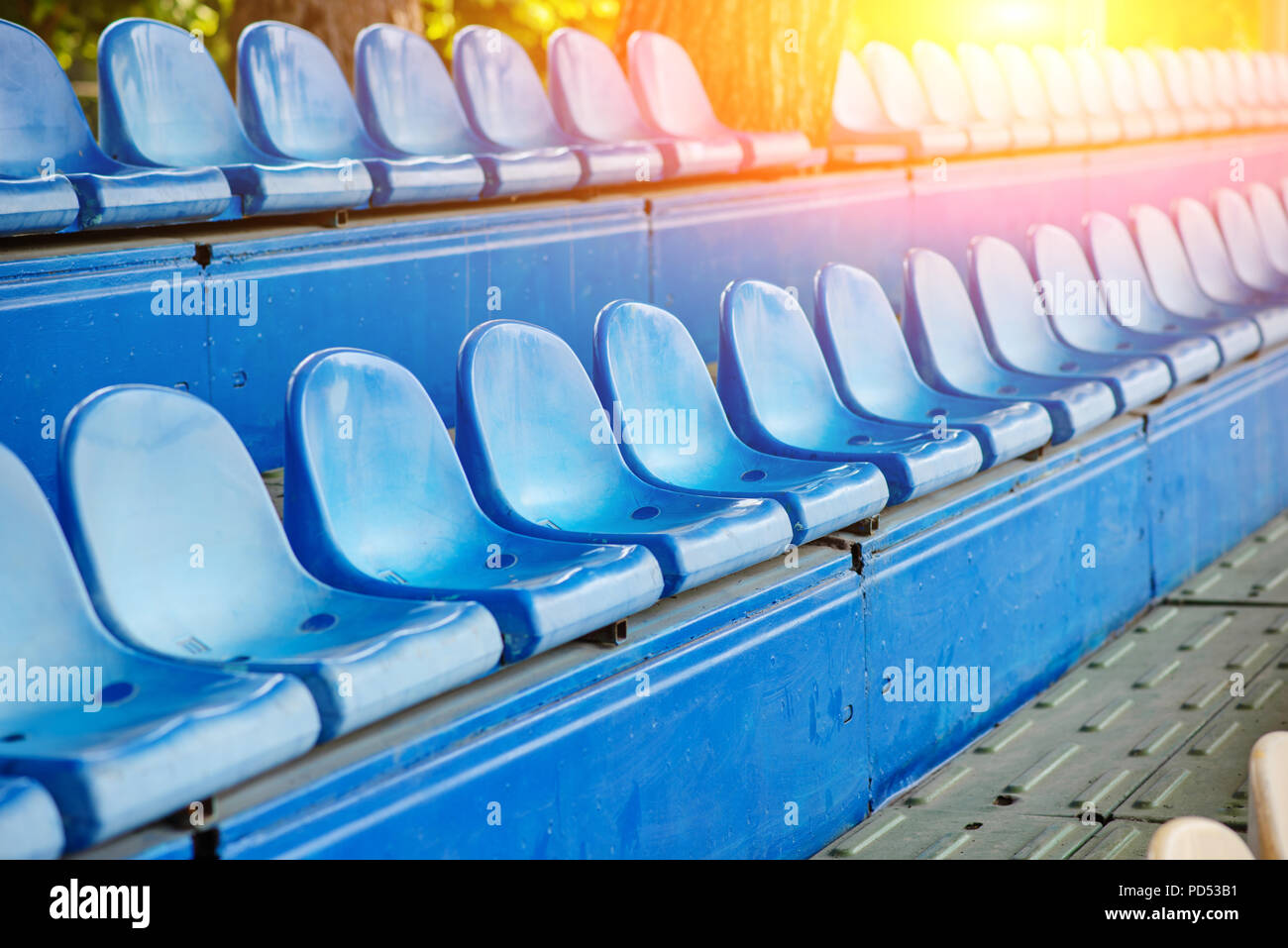Empty plastic chairs in the stands of the stadium Stock Photo - Alamy