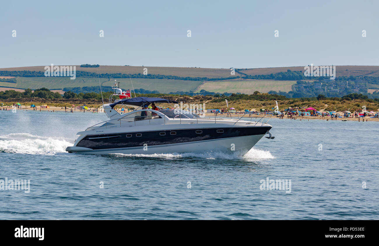 People out enjoying the very hot weather, riding the waves, boating and ...