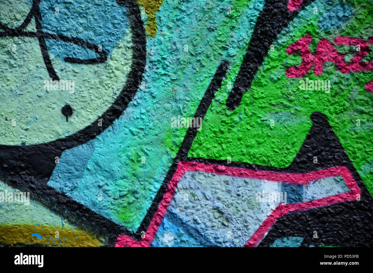 Background image of the wall decorated with colorful abstract graffiti ...
