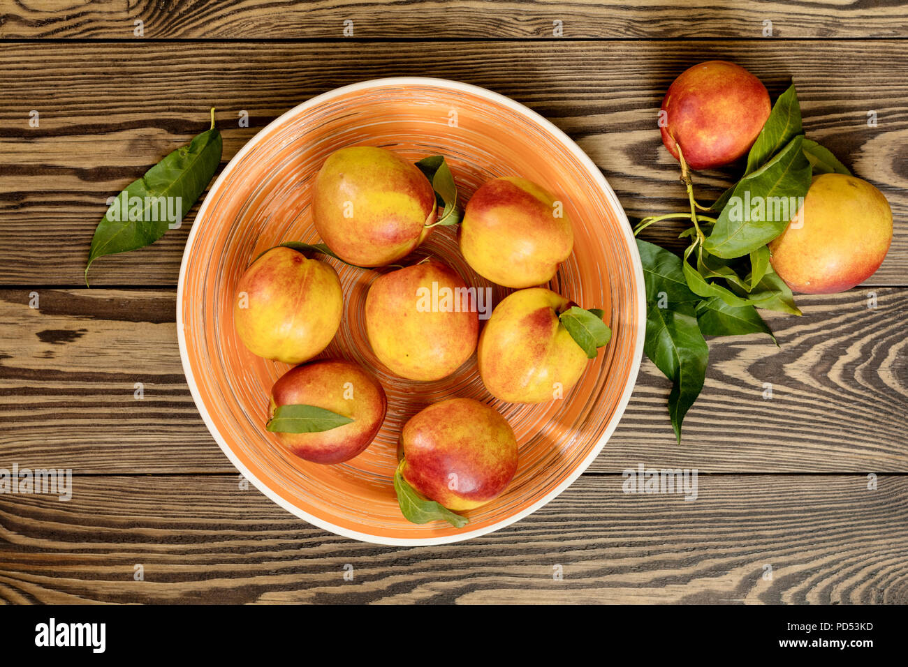 Many juicy beautiful amazing nice peaches on dark wooden background ...