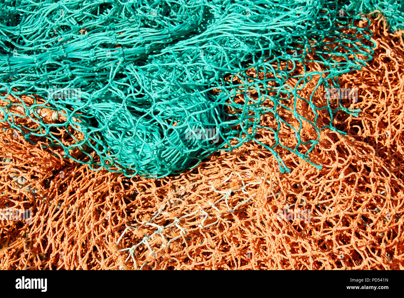 Brightly colored fishing nets in the sun to dry Stock Photo - Alamy