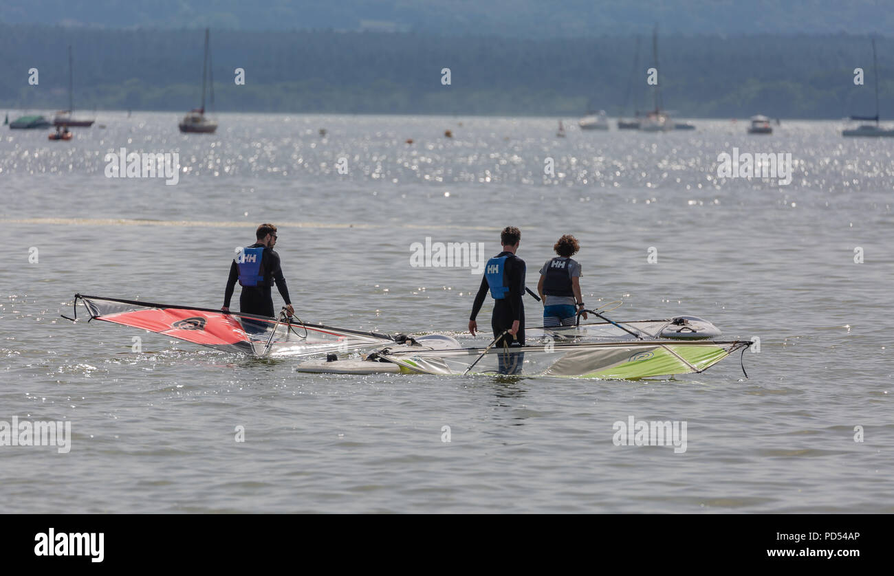 People out enjoying the very hot weather, riding the waves, boating and ...