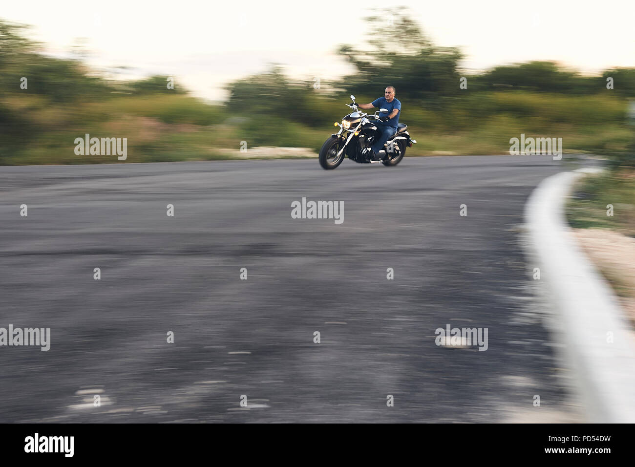 Fat man riding motorcycle hi-res stock photography and images - Alamy