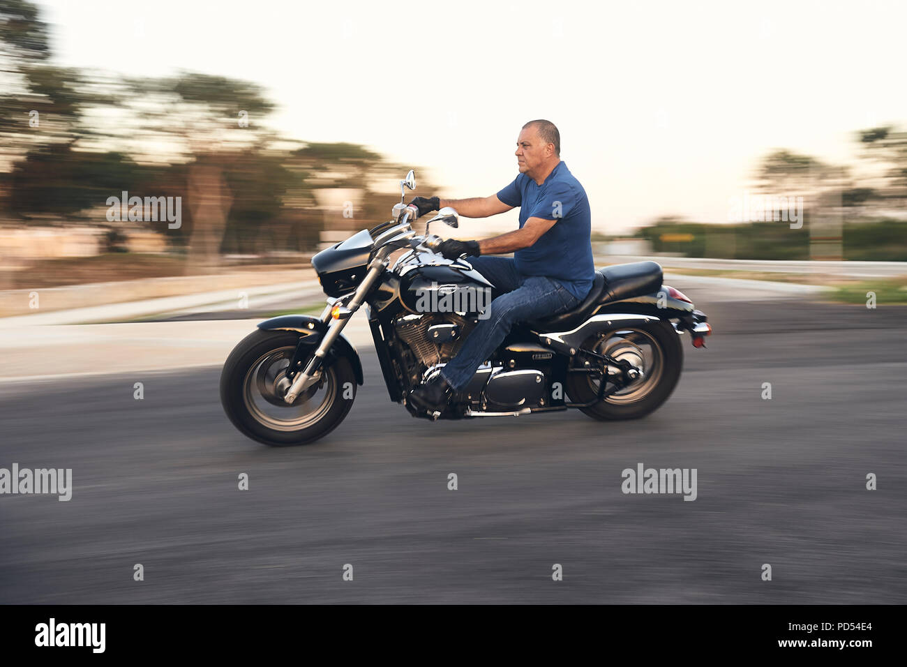 Fat man riding motorcycle hi-res stock photography and images - Alamy