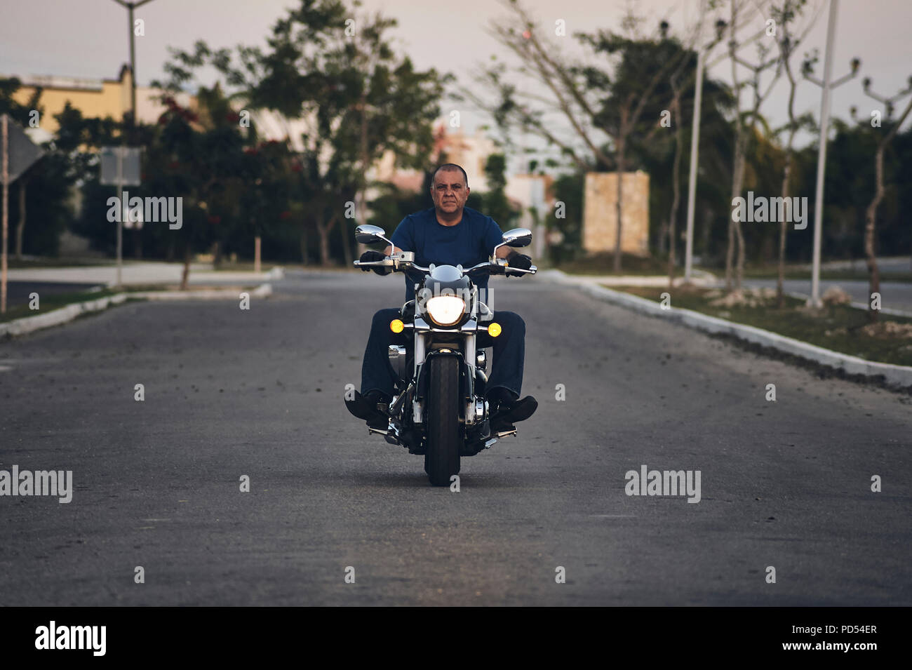 Fat man riding motorcycle hi-res stock photography and images - Alamy