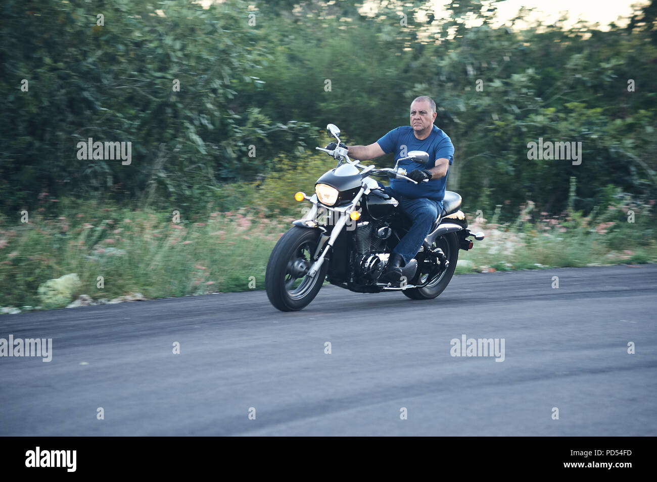 Fat man riding motorcycle hi-res stock photography and images - Alamy
