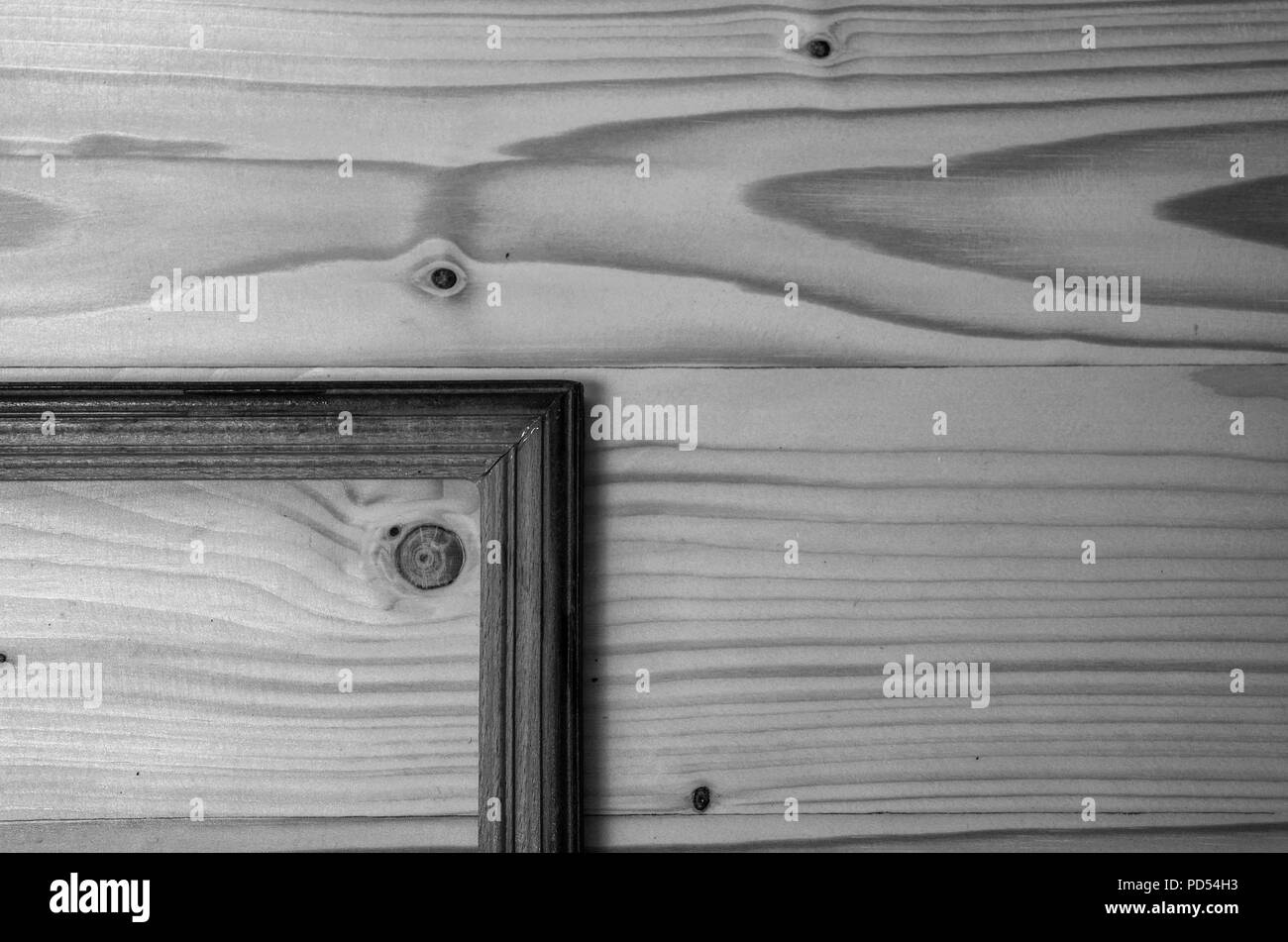 Photo frame on a wooden table in black and white Stock Photo - Alamy