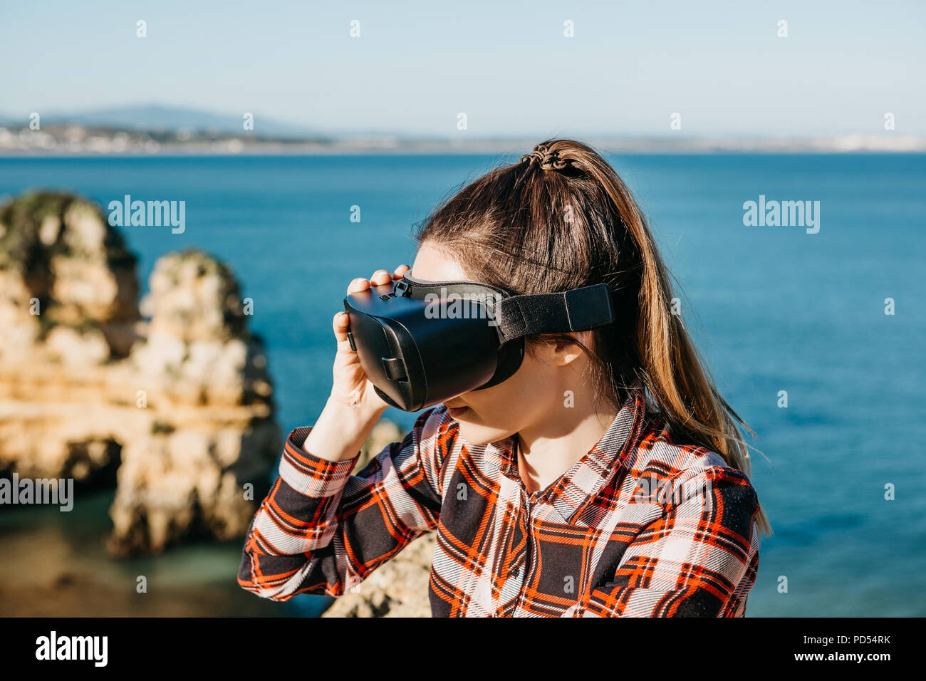 The girl in glasses of a virtual reality. Modern technology in everyday ...