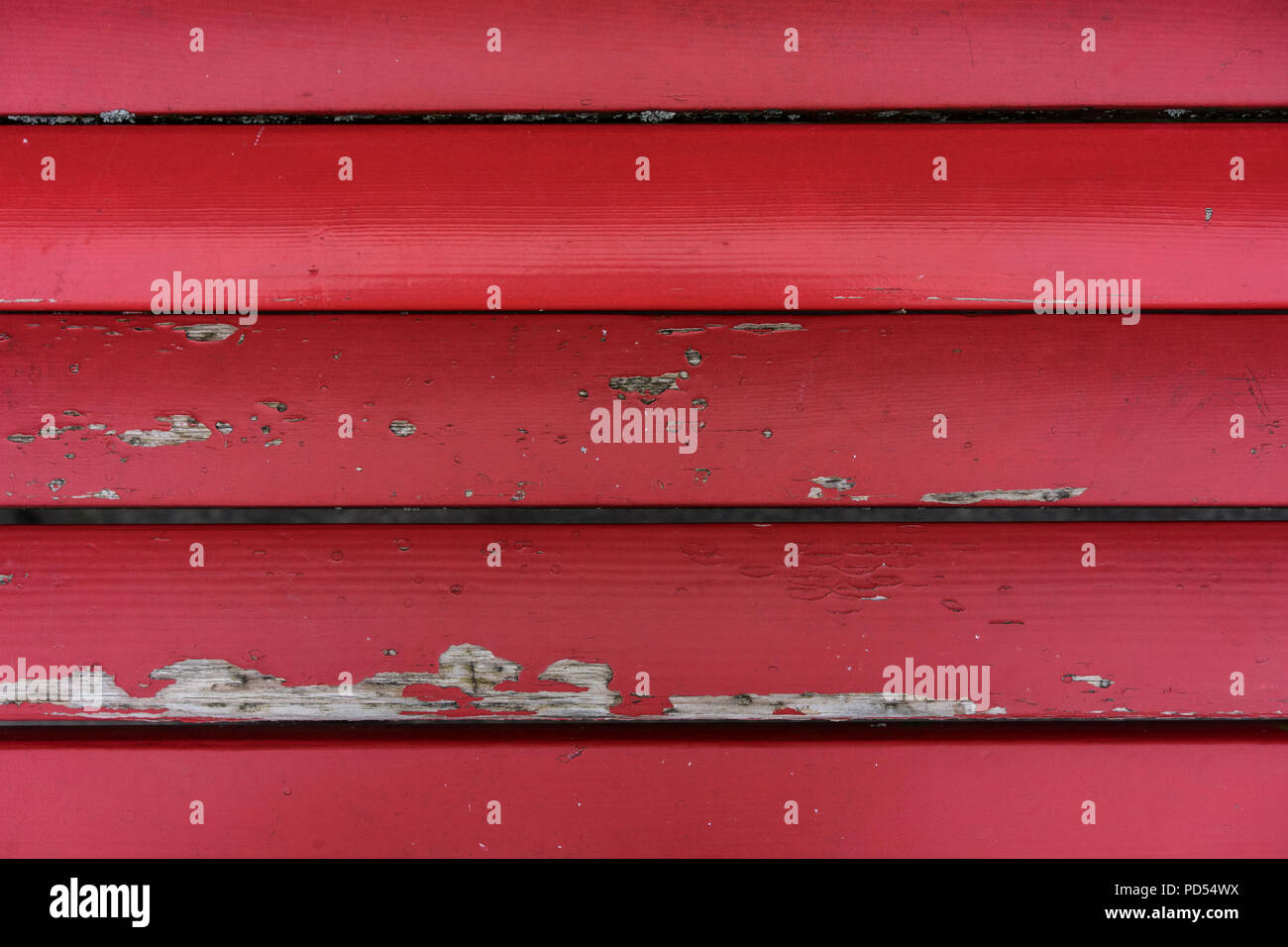 vintage red board from bench with paint chipped off top view Stock ...