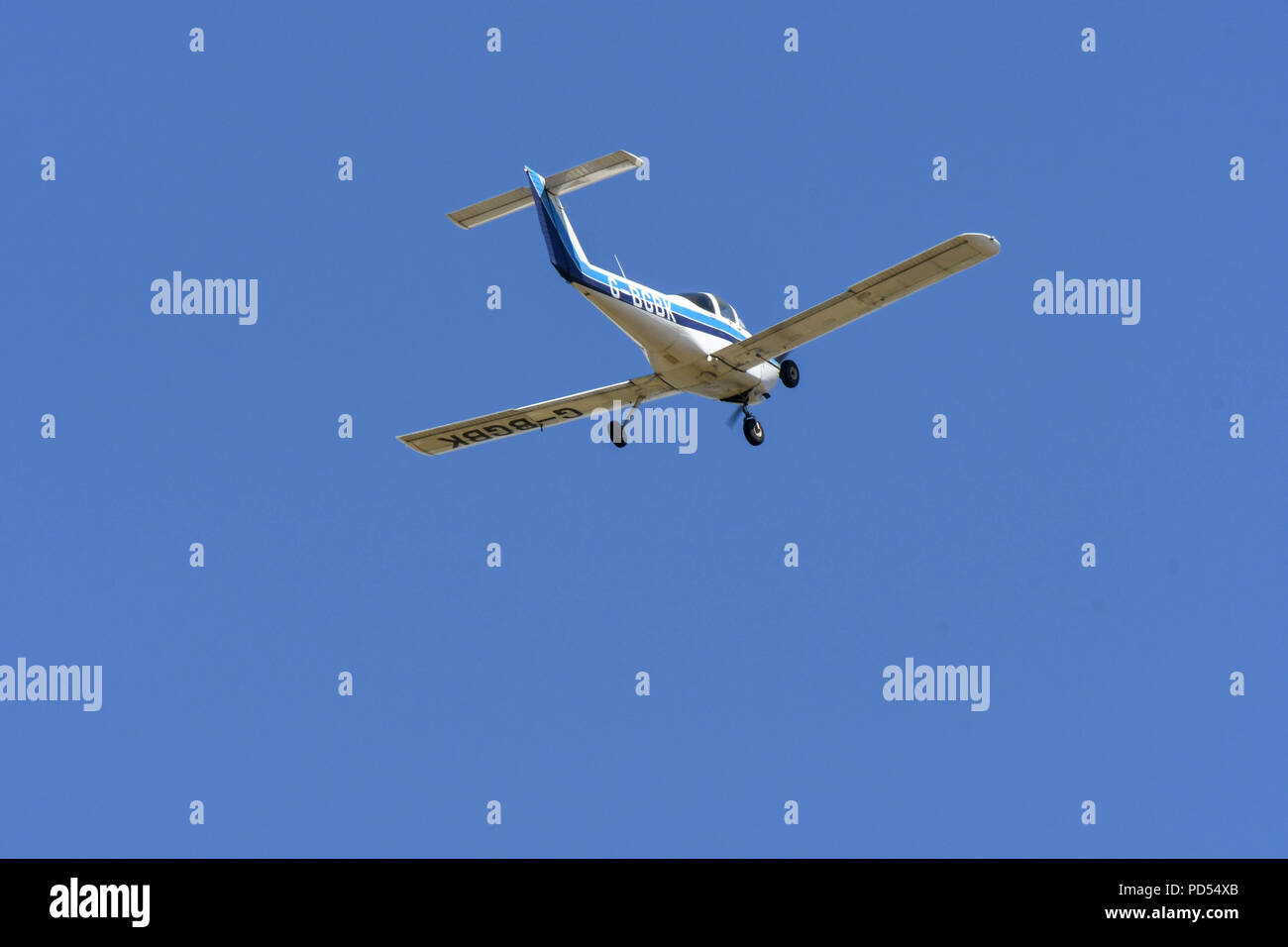 Piper PA38 Tomahawk fixed wing light aircraft in flight with a deep ...