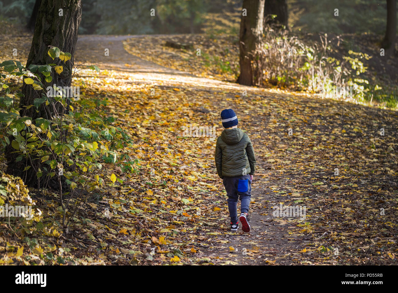 School boy walking alone hi-res stock photography and images - Alamy