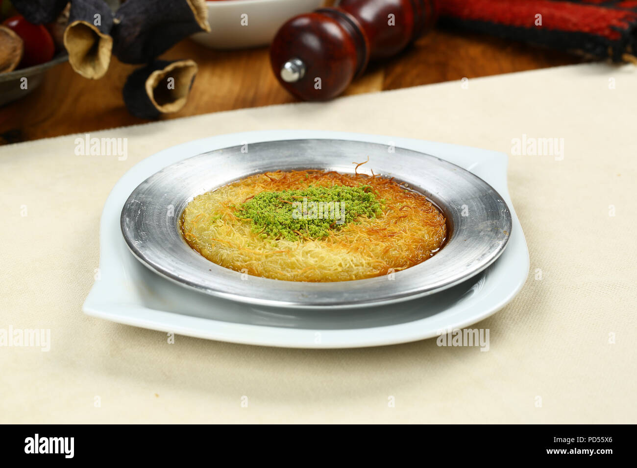 Delicious traditional Turkish dessert kunefe with pistachio powder ...