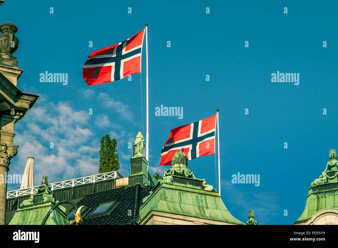 Flags flying in blue sky hi-res stock photography and images - Alamy