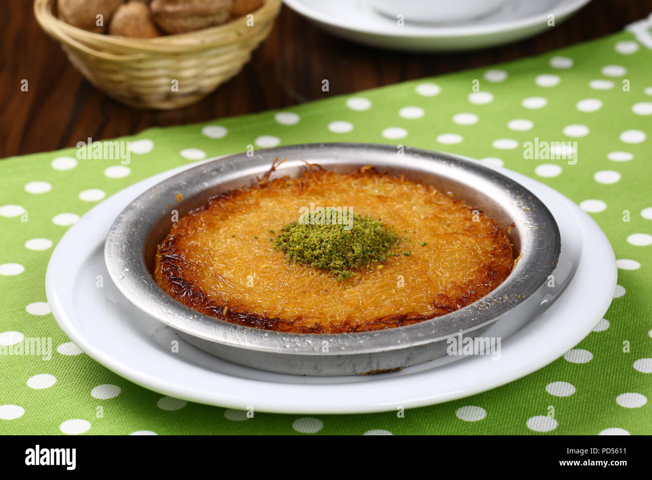 Delicious traditional Turkish dessert kunefe with pistachio powder ...