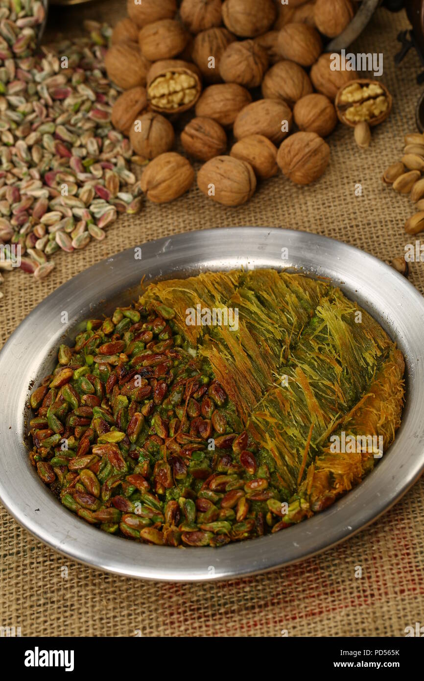 Delicious traditional Turkish dessert kunefe with pistachio powder ...