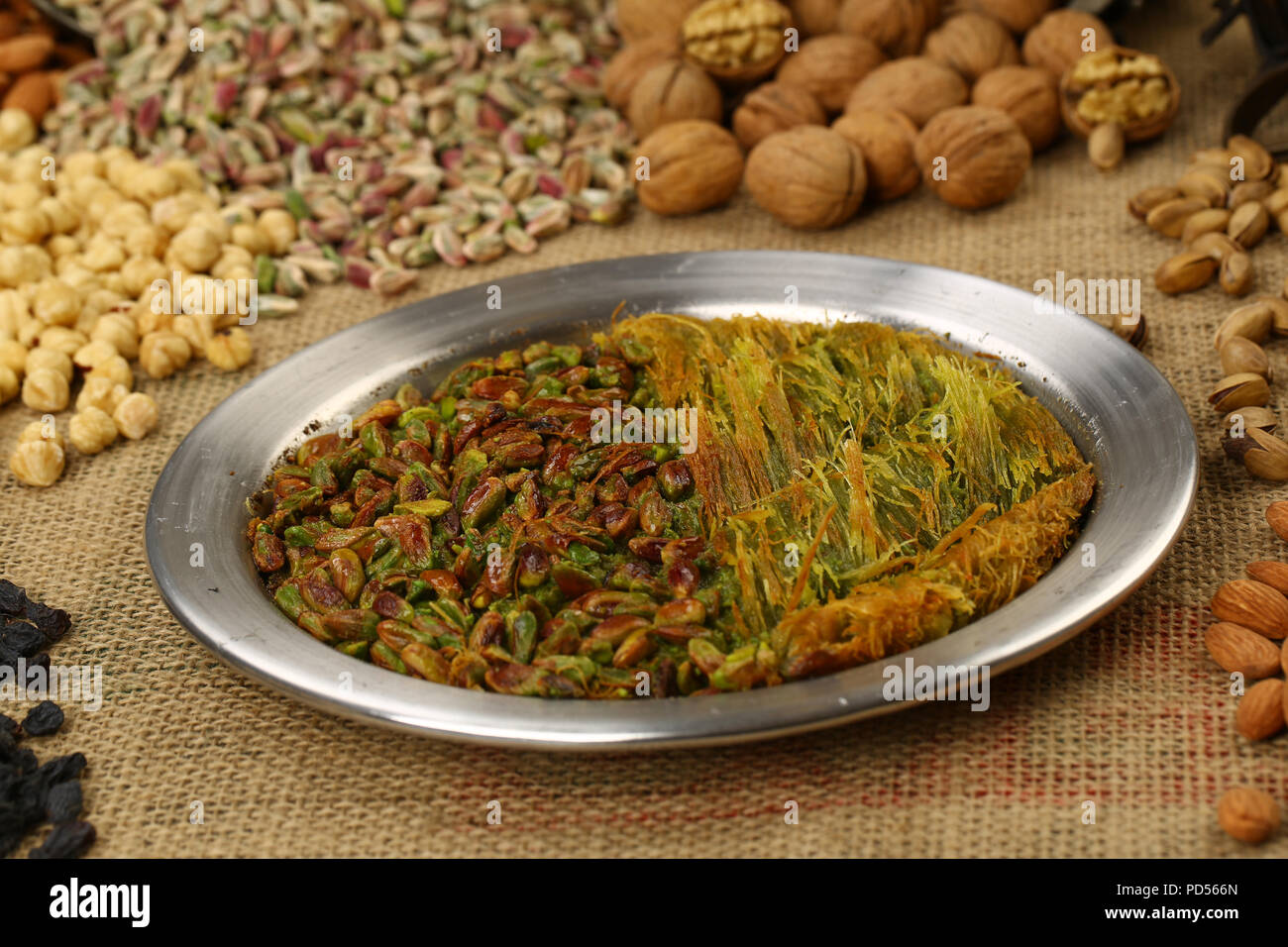 Delicious traditional Turkish dessert kunefe with pistachio powder ...