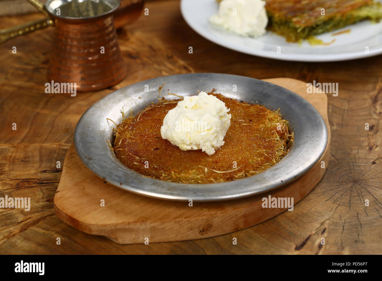 Delicious traditional Turkish dessert kunefe with pistachio powder ...