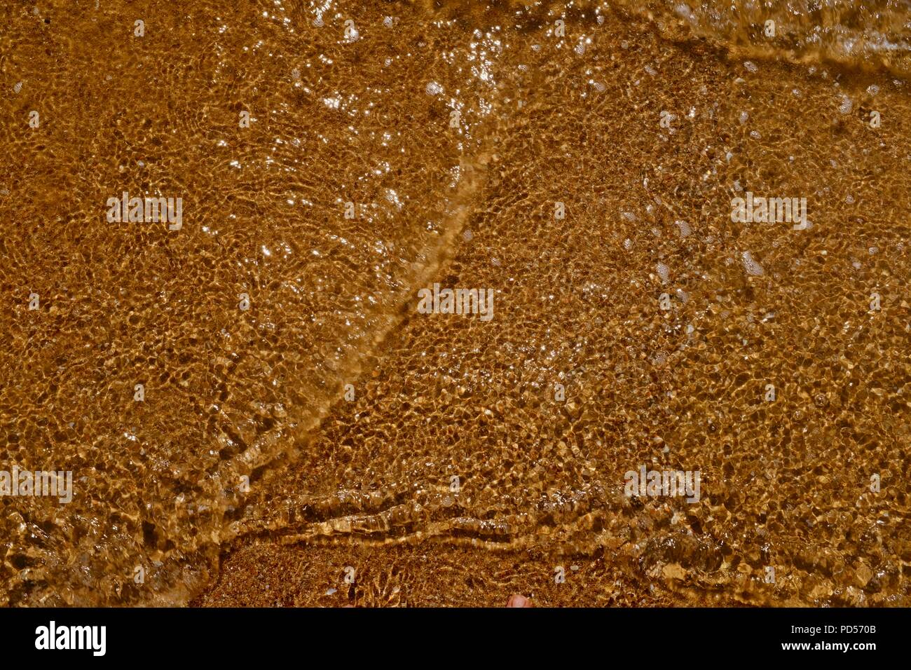 Water gently flowing over sand, Toomulla QLD, Australia Stock Photo - Alamy