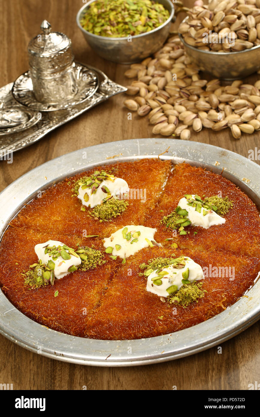 Delicious traditional Turkish dessert kunefe with pistachio powder ...