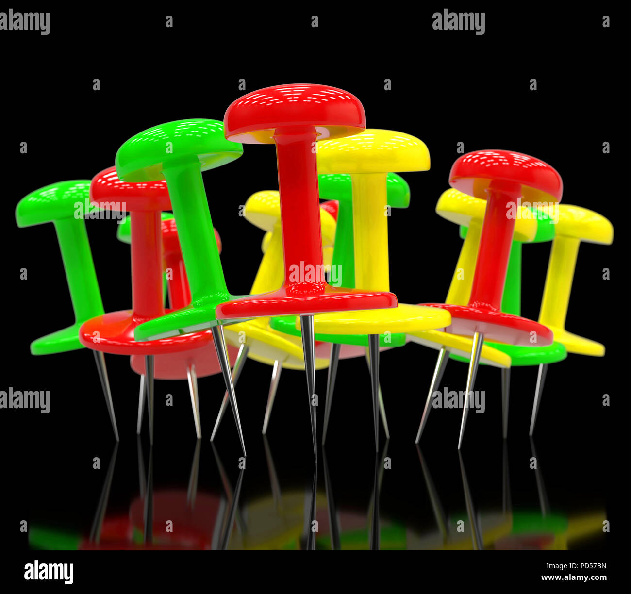 Close-up on a group of tacks on black background, with depth of field ...