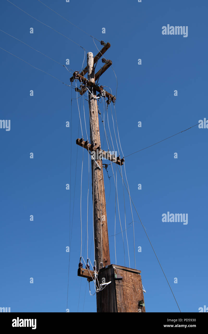 Old vintage electrical pole and lines in the ghost town of Bodie ...