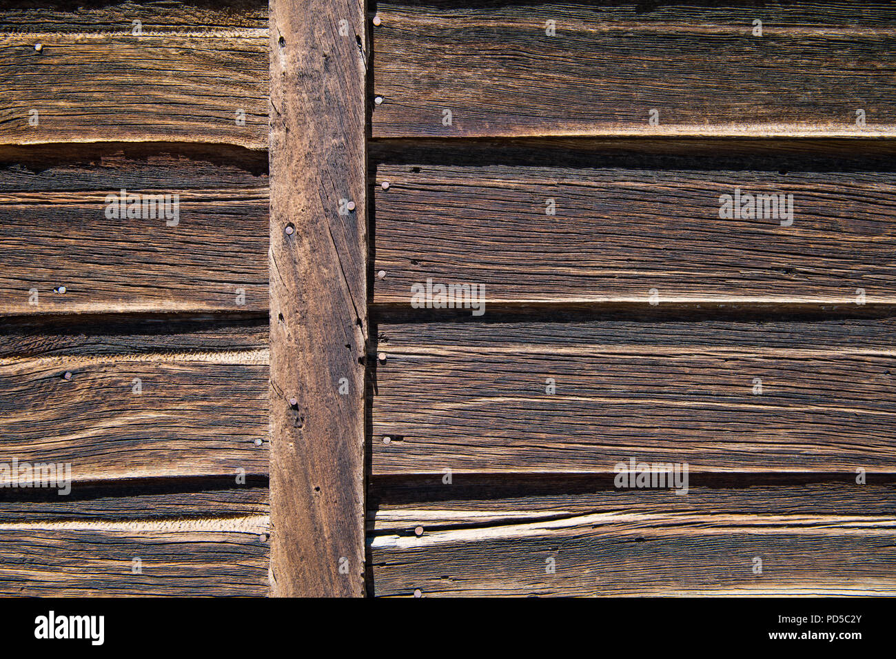 Weathered wood plank siding background texture with natural brown color ...