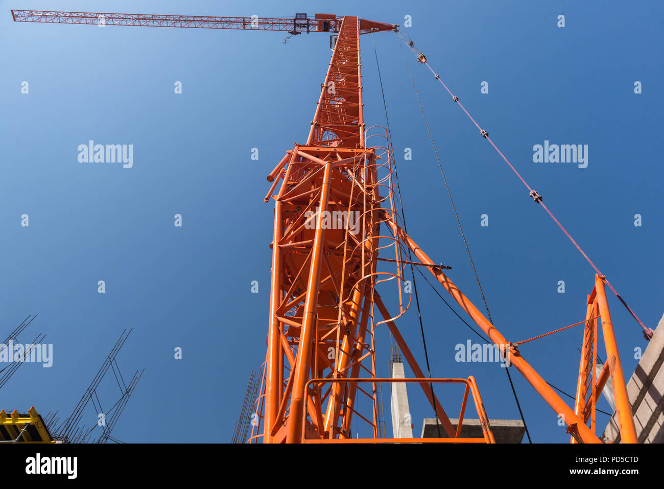 construction crane and unfinished building on sky background. bottom ...