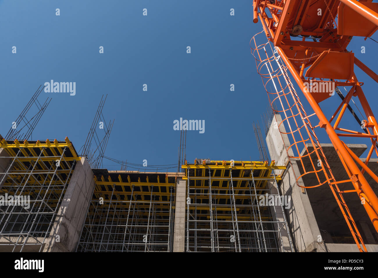 construction crane and a concrete structure of the building on a ...